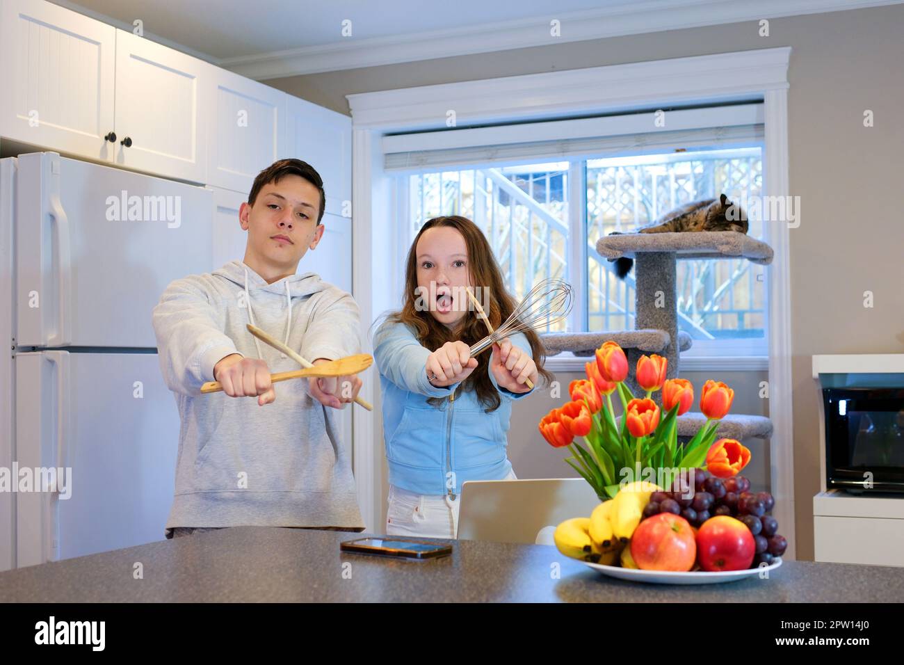 Family teenagers playing table hi-res stock photography and images - Alamy