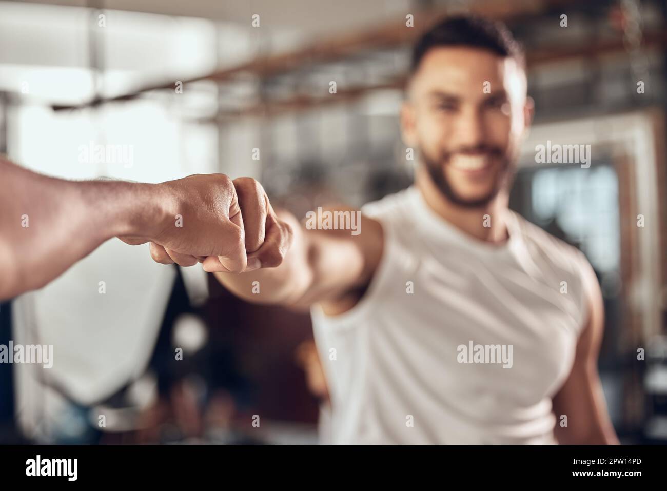 Two athletes giving each other a fist bump. bodybuilders celebrate ...