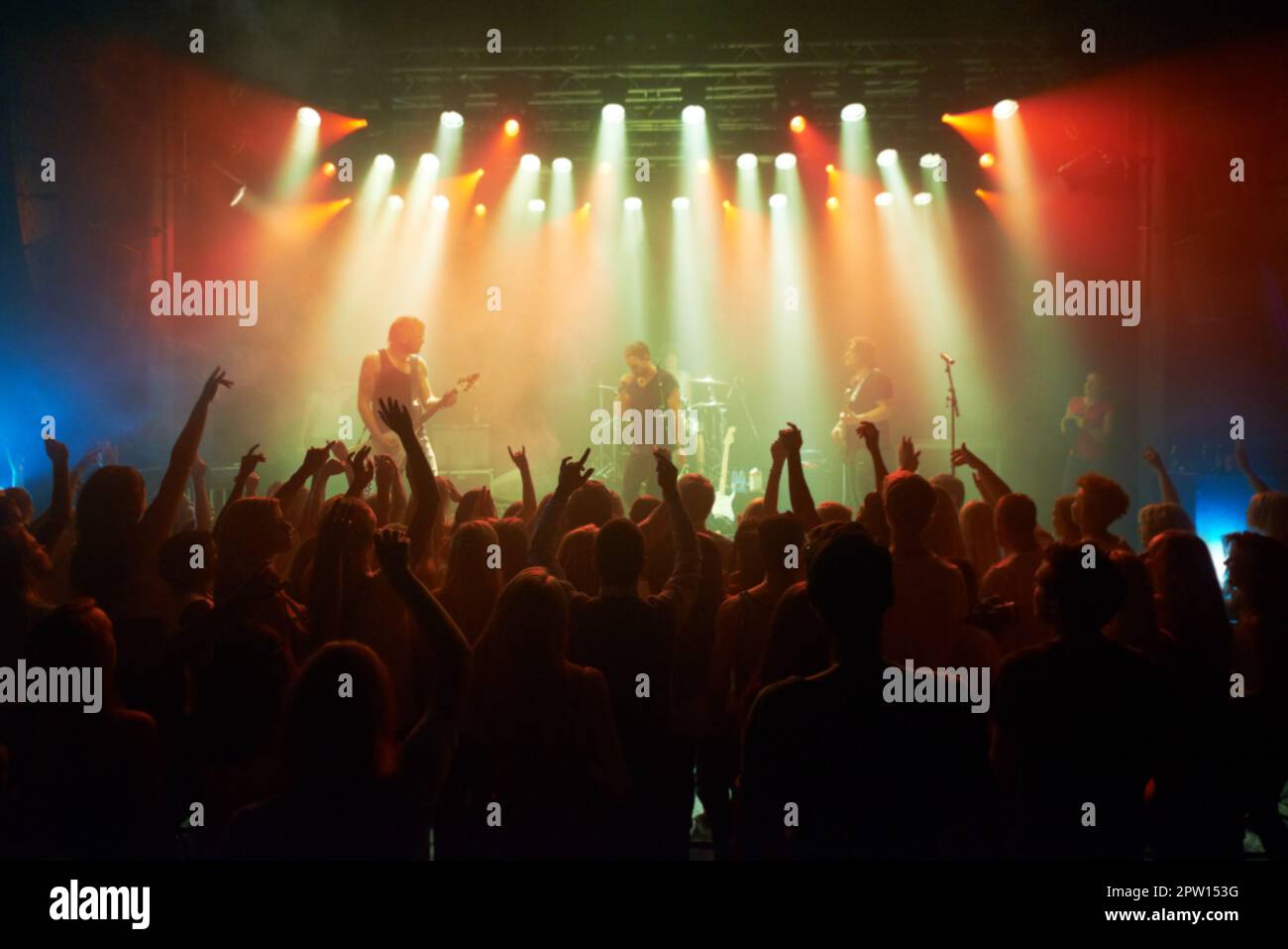 Rock, band and crowd of people at concert for stage performance, party ...