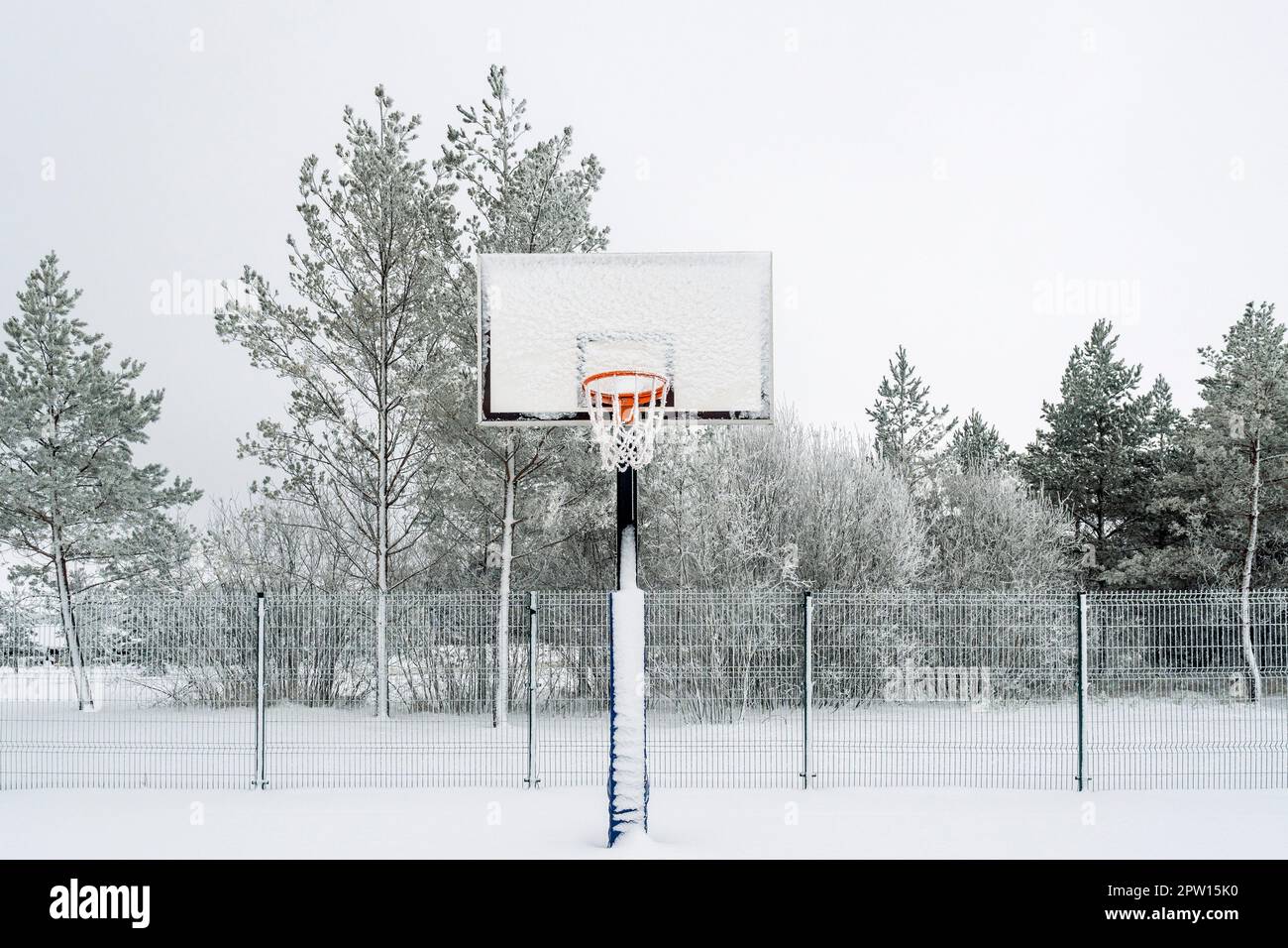Snow covered basketball court. A lot of snow. The platform is empty ...