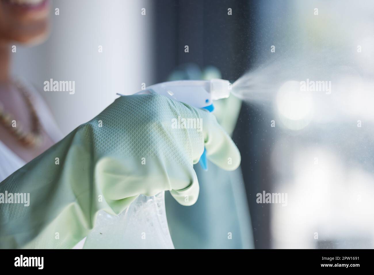 Hands, spray and detergent for cleaning window, domestic or housework ...