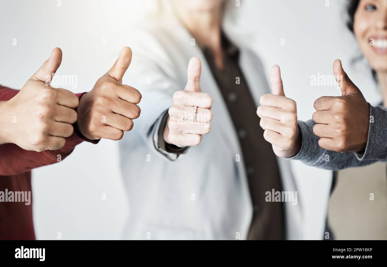Diverse group of hands showing thumbs up. Team of multiracial business ...