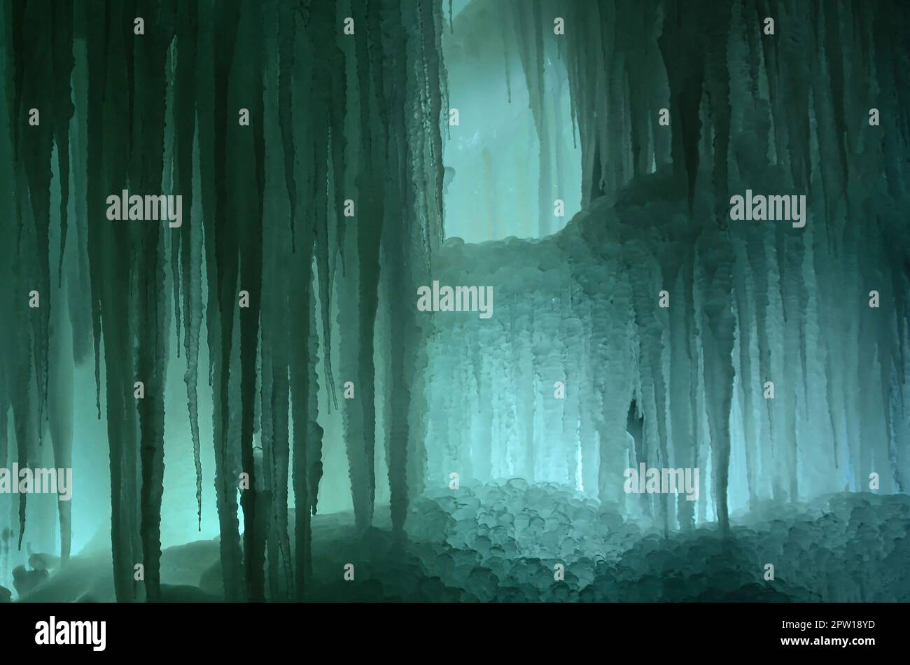 Huge ice icicles. Fragment of large blocks of ice frozen waterfall of ...