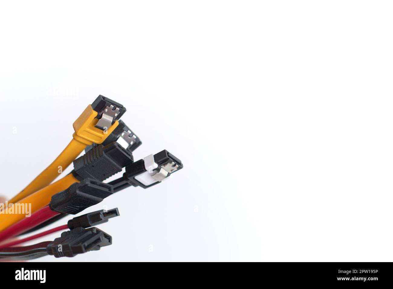 Red, black and yellow data cables on white background. Data storage ...