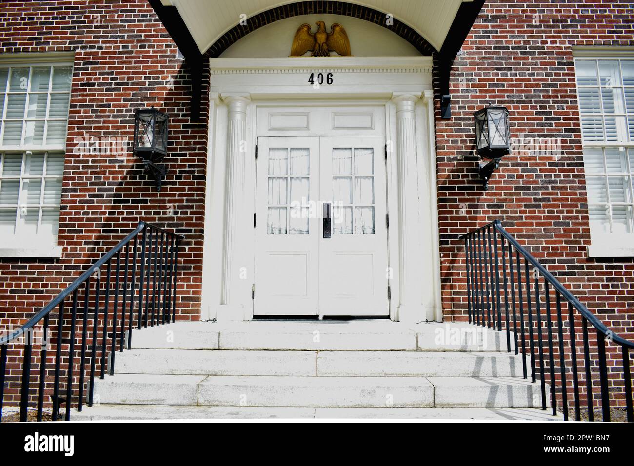 Imposing front door entrance with steps and sconces Stock Photo - Alamy
