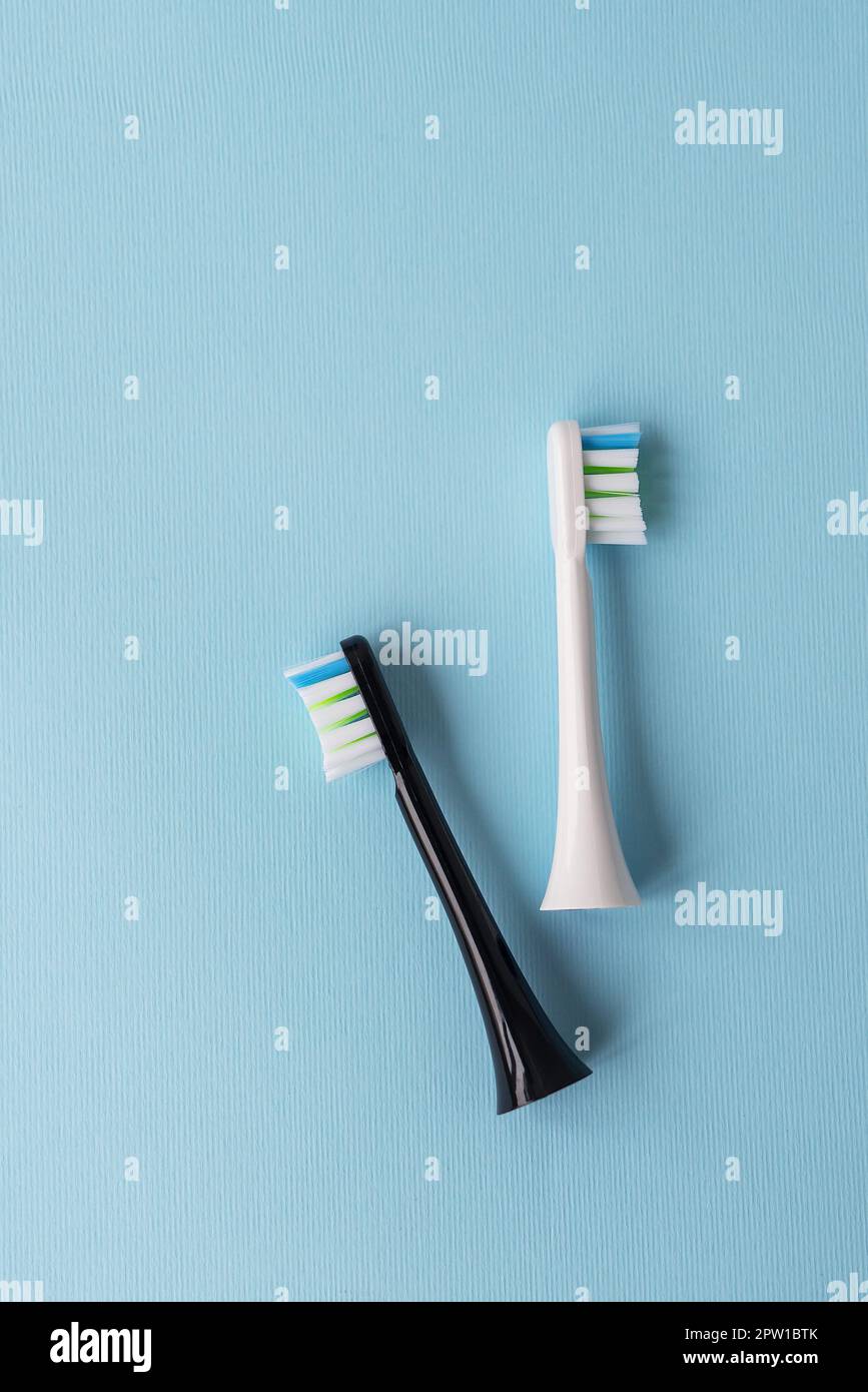 Modern electric toothbrush on a blue background. Hygiene concept for ...