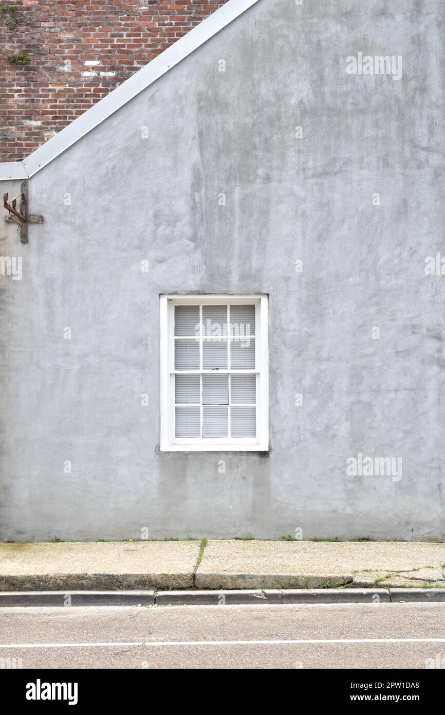 Single white window on gray stucco background Stock Photo - Alamy