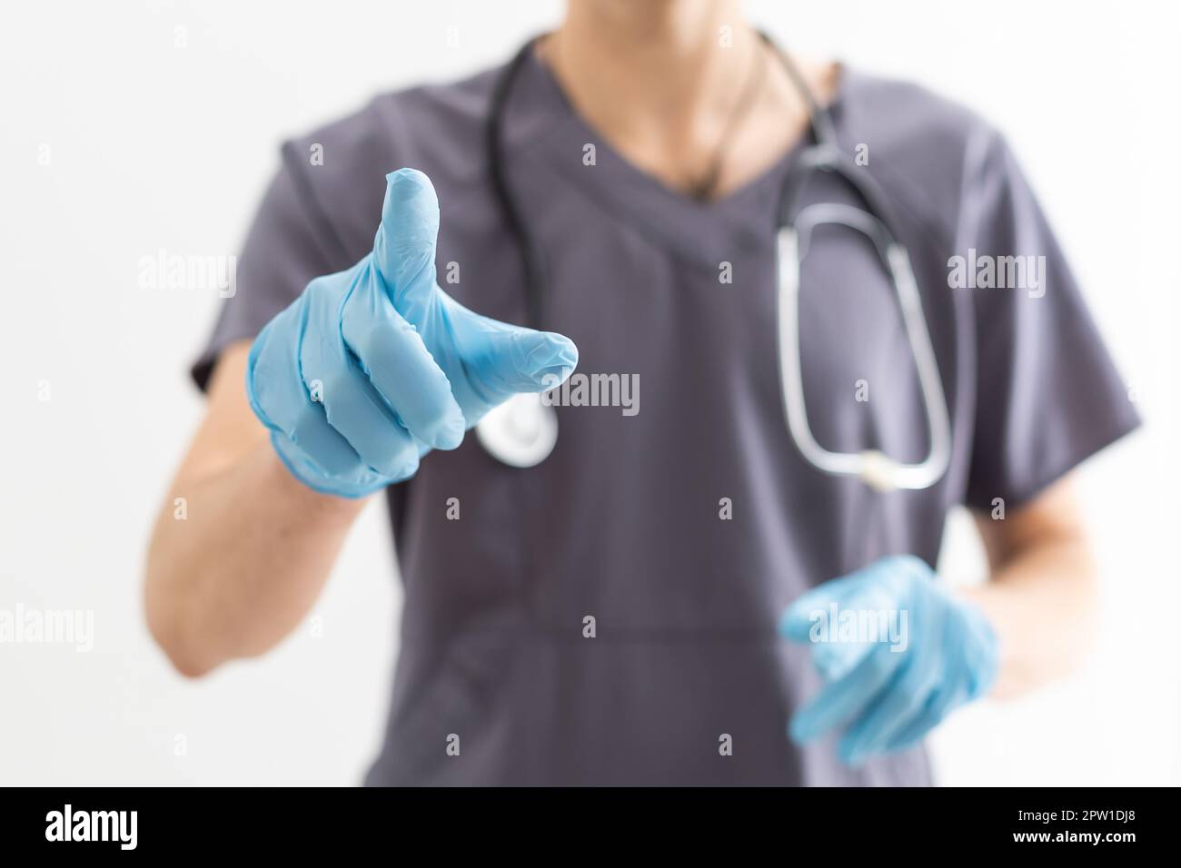 View of a Doctor pointing his finger at the clinic Stock Photo - Alamy