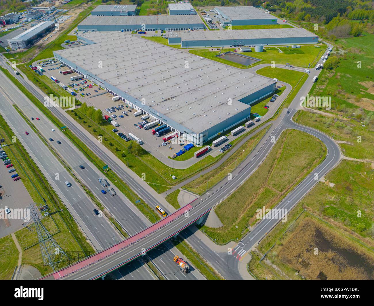 Aerial view of the logistics park with warehouse, loading hub and many ...