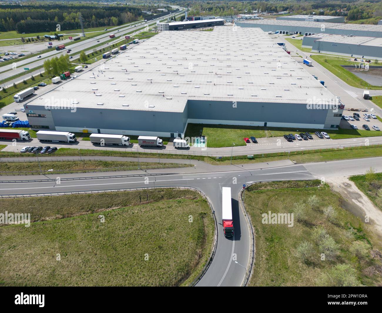 Aerial view of the logistics park with warehouse, loading hub and many ...