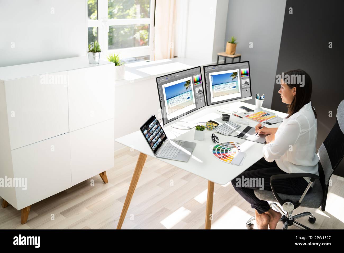 Graphic Designer Artist Working On Multiple Computer Screens Stock ...