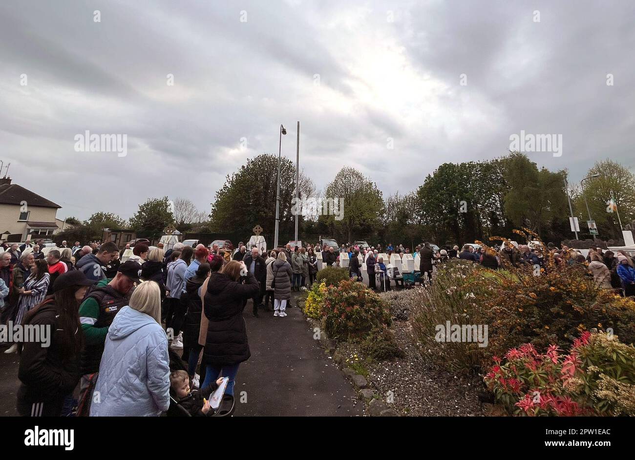 People attend a vigil at Grotto in Strabane for for the victims of a ...