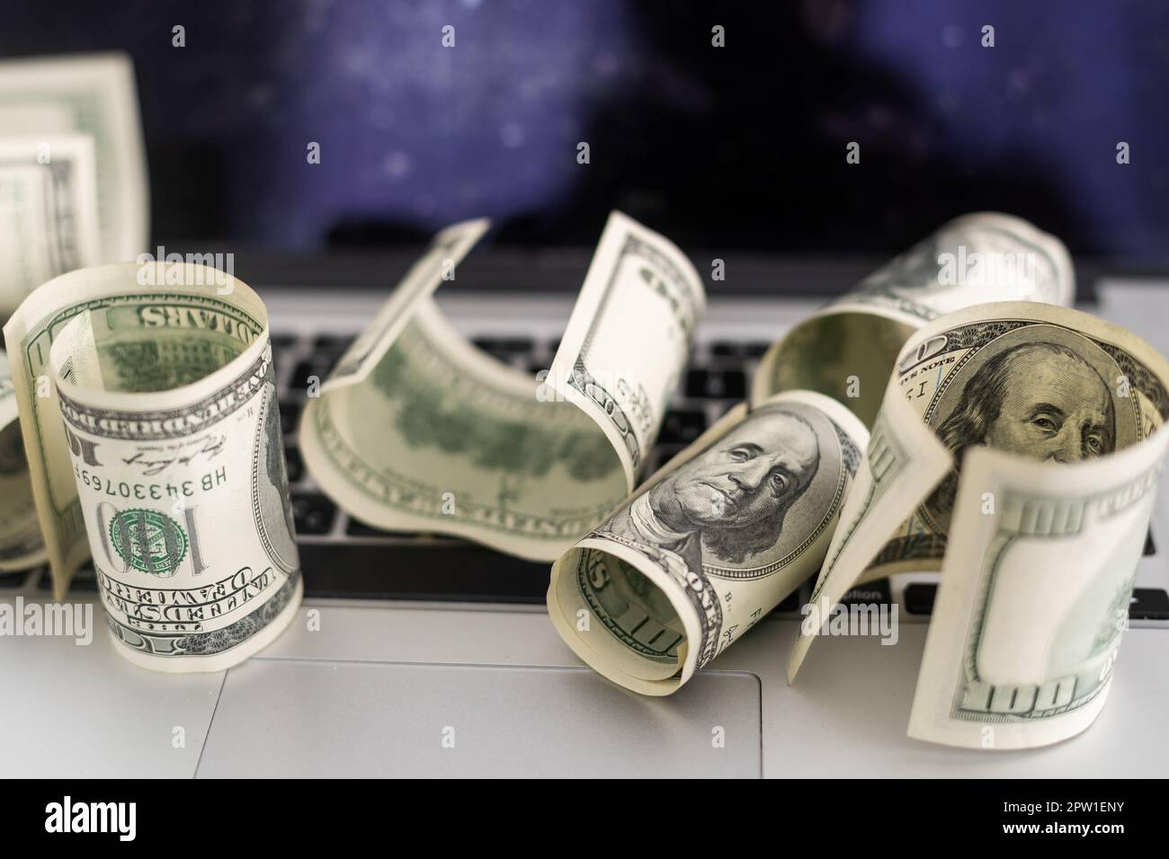 Money on computer keyboard. roll Stock Photo - Alamy