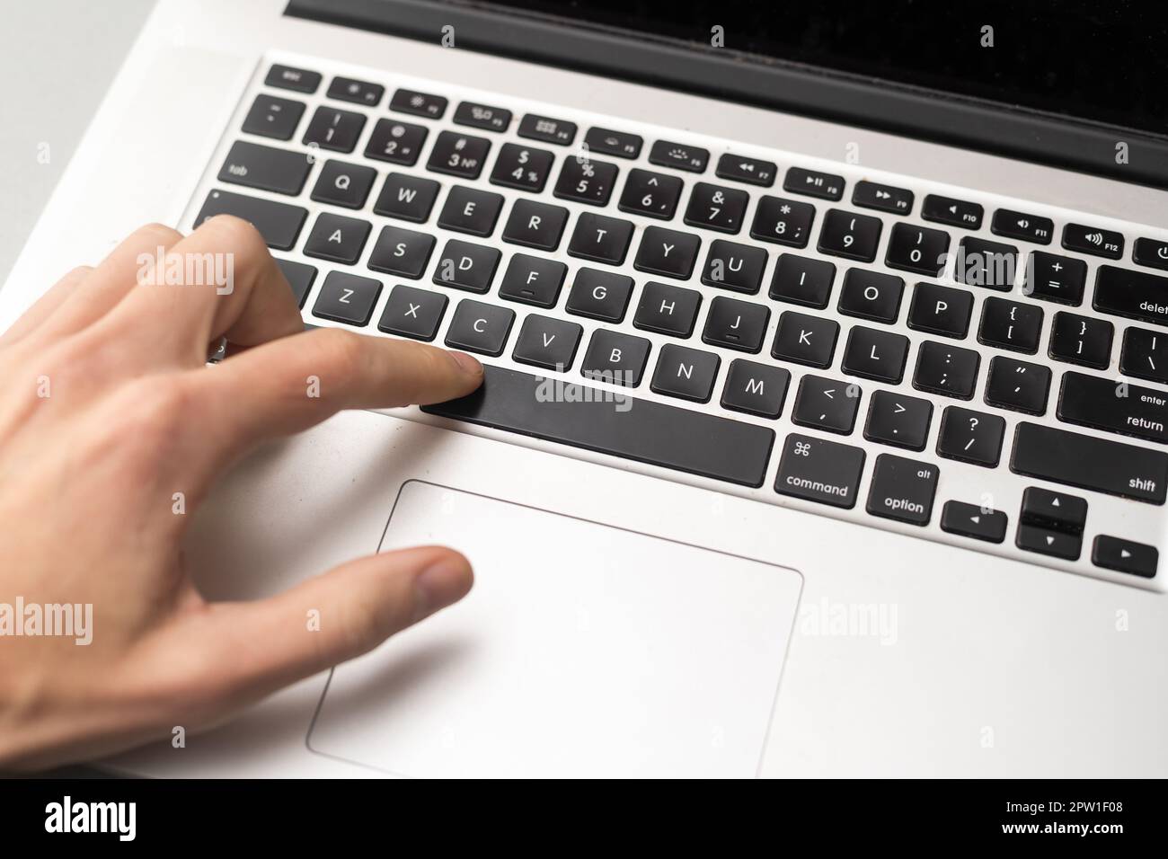 Finger pushing the button of keyboard Stock Photo - Alamy