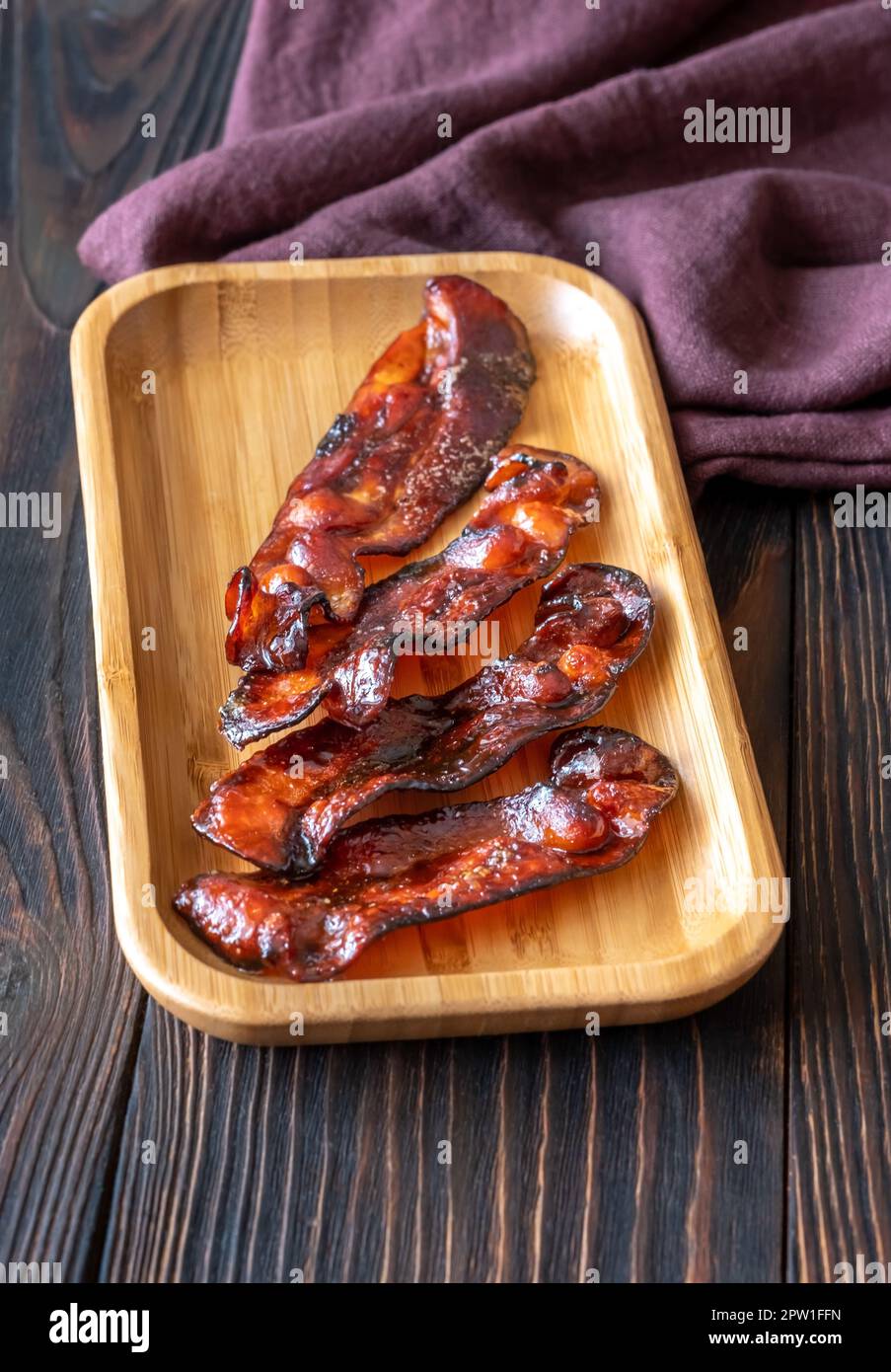 Fried bacon strips glazed in brown sugar Stock Photo - Alamy