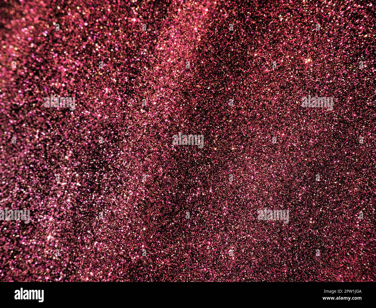 Bokeh light of pink glitters on black background. Magenta glitter ...
