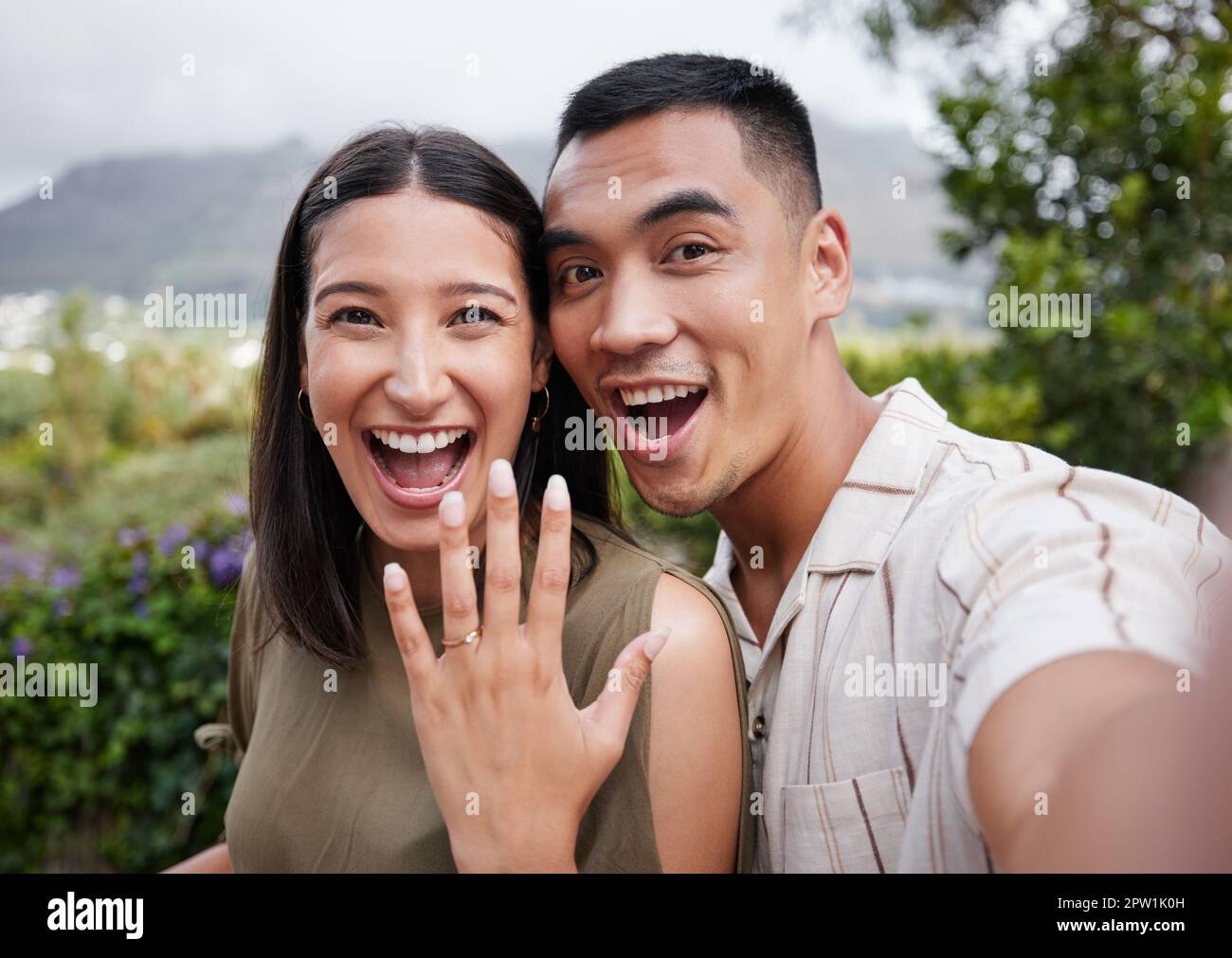 Engagement, ring and celebration with a young couple announcing their ...