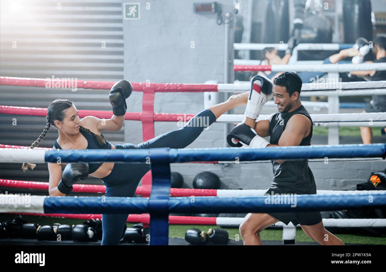 Fit, active and healthy kickboxing athletes exercise training together ...