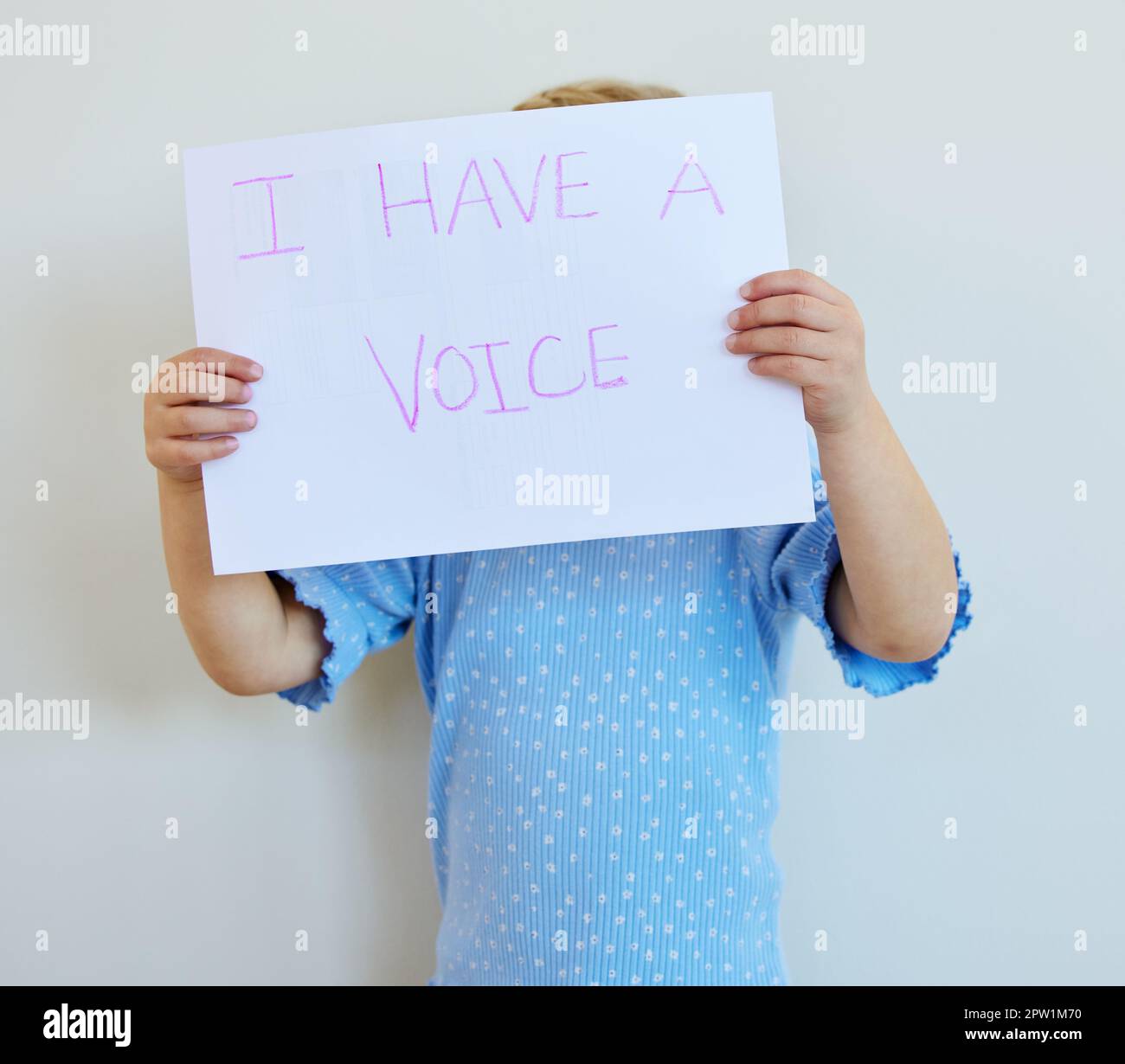 Little girl protesting against domestic violence and child rape with a ...