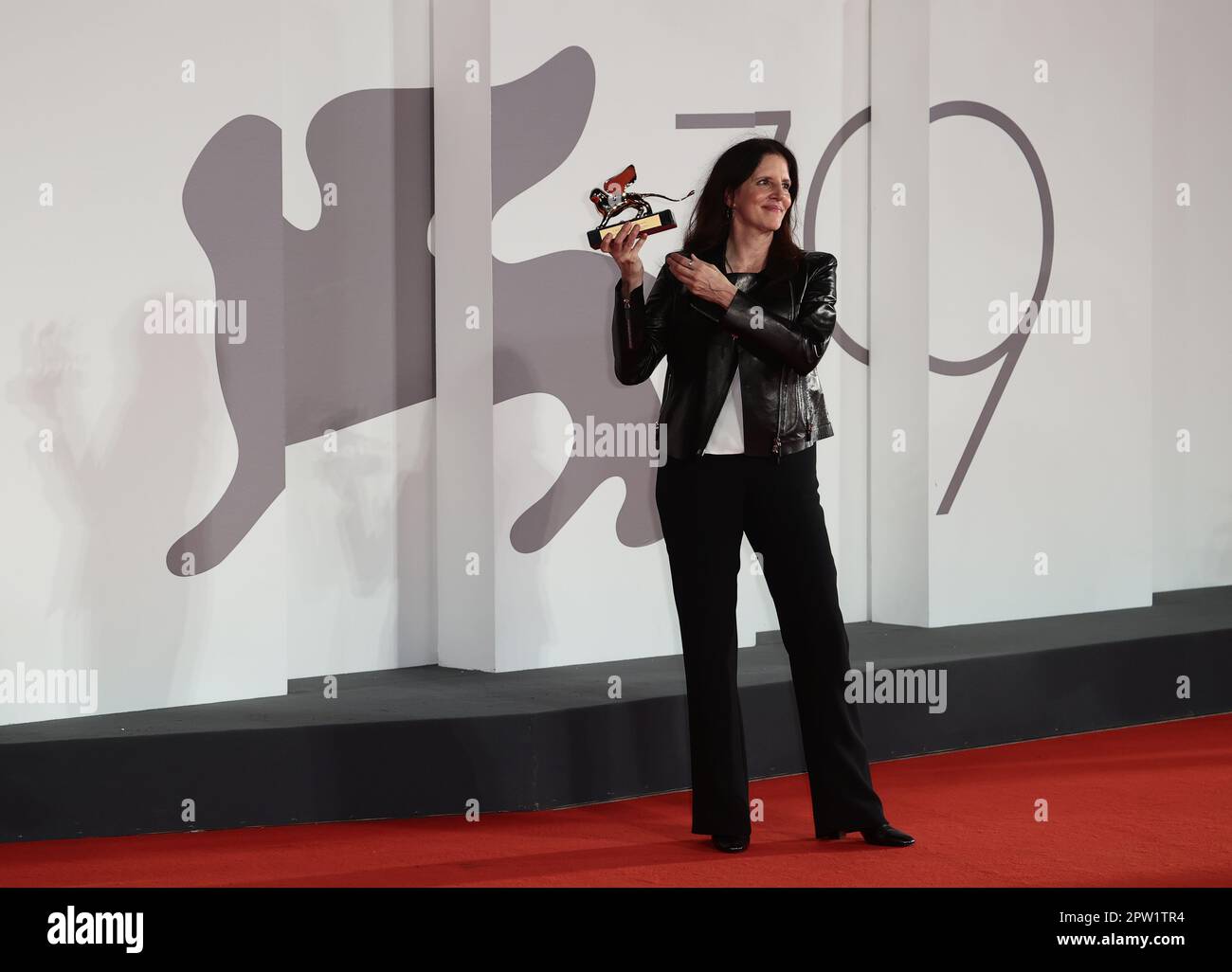 VENICE, ITALY - SEPTEMBER 10: Laura Poitras poses with the Golden Lion ...