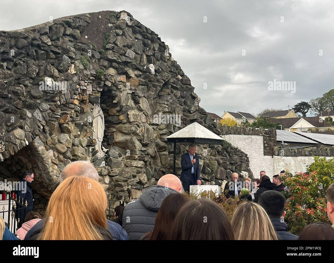 People attend a vigil at Grotto in Strabane for for the victims of a ...