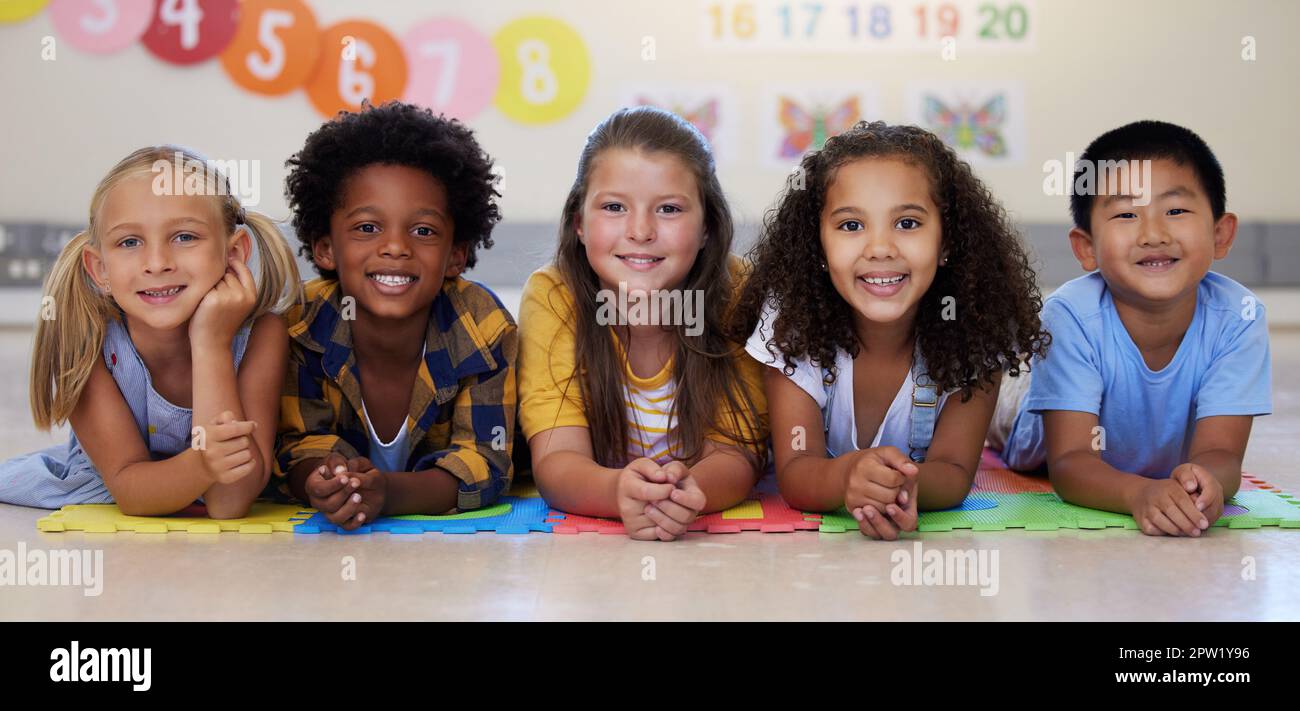 Group happy kids laying in hi-res stock photography and images - Alamy