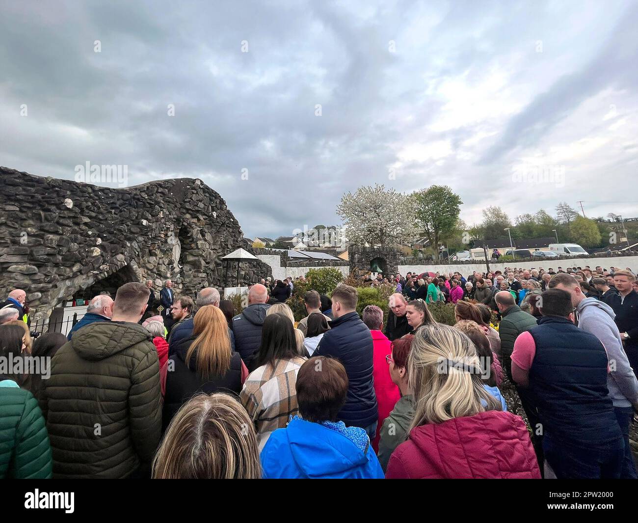 People attend a vigil at Grotto in Strabane for for the victims of a ...