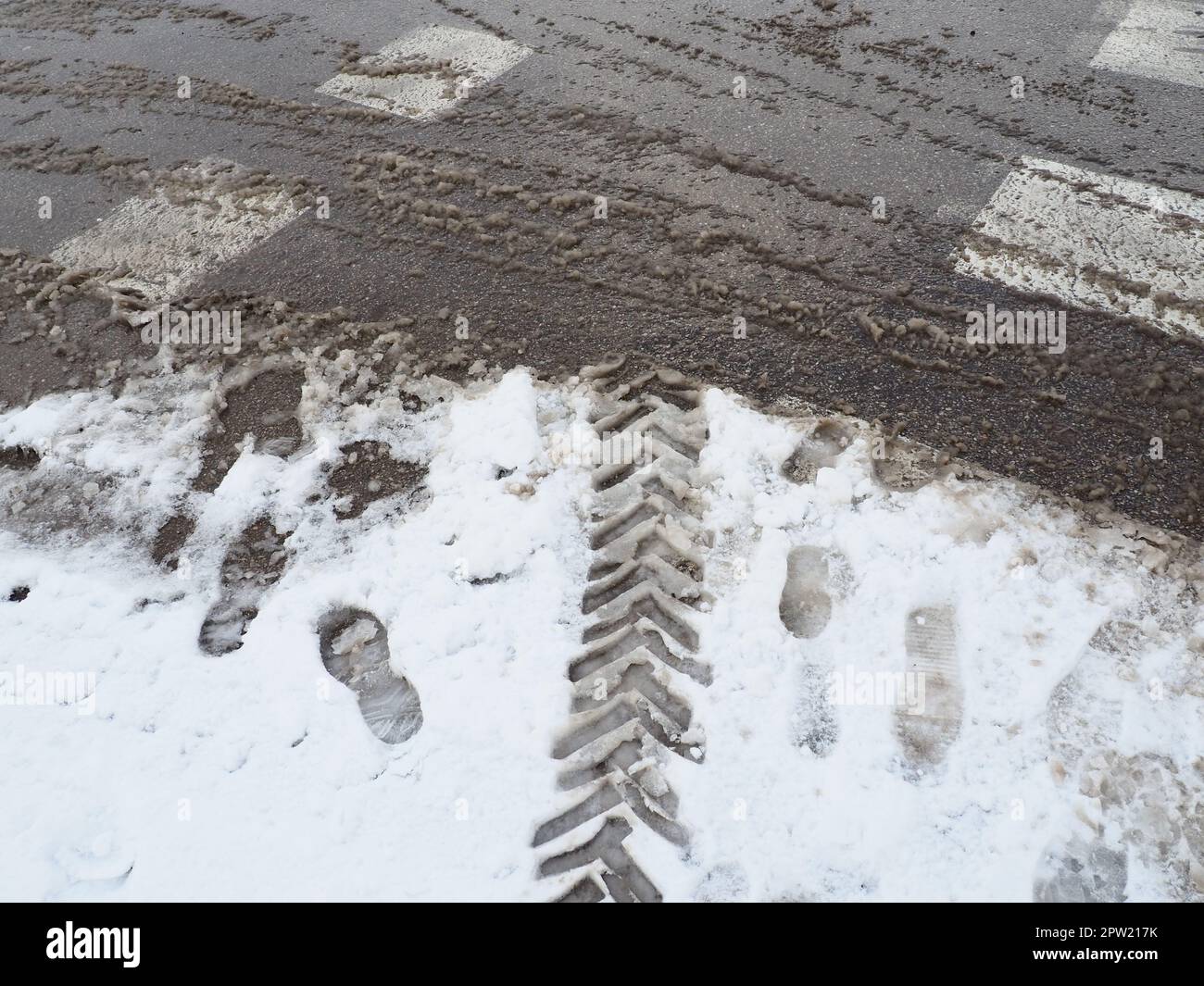 A fork or siding from a roundabout. Snowdrifts on the side of the road ...