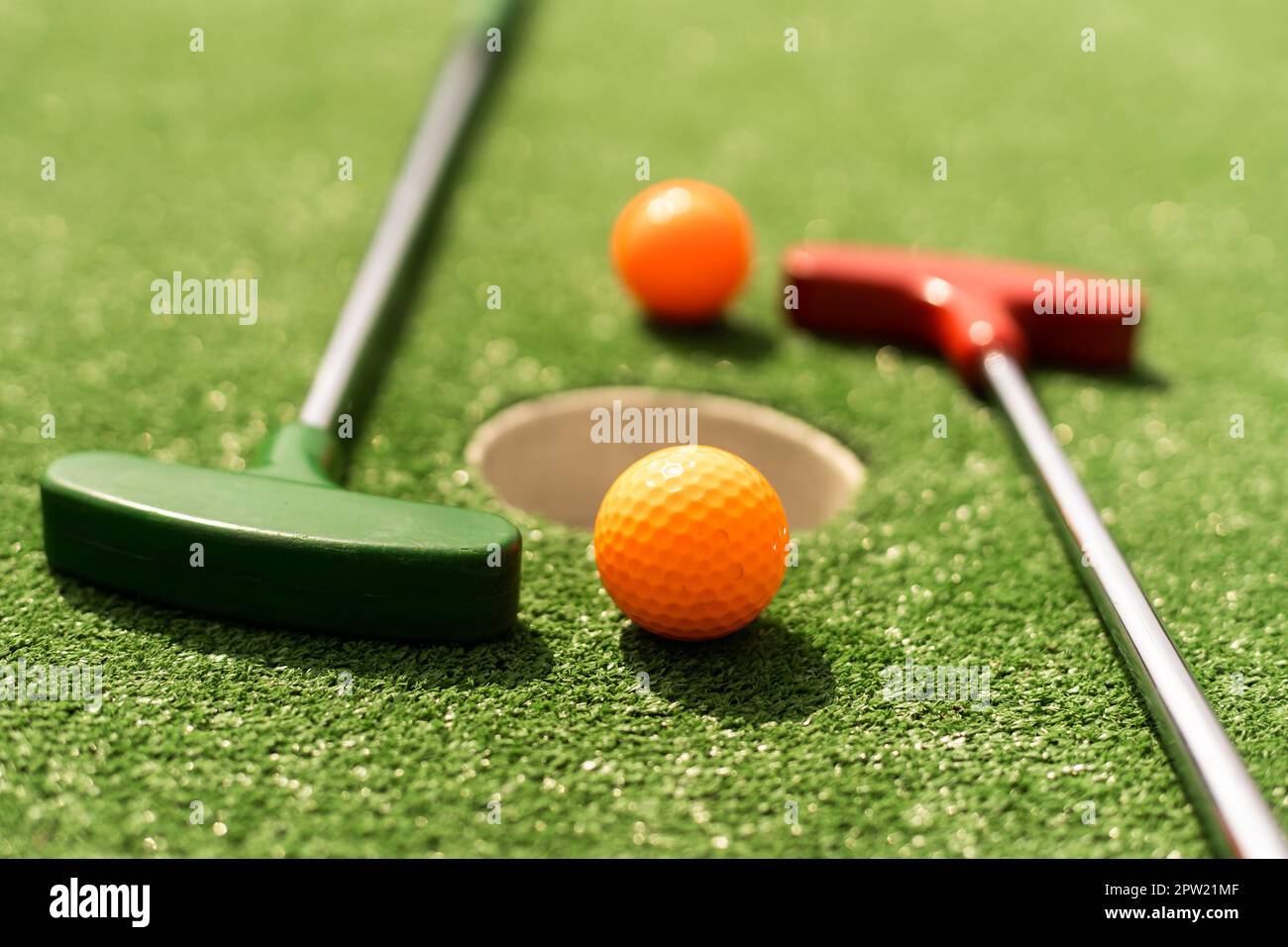 Mini-golf ball on artificial grass. Summer season game Stock Photo - Alamy
