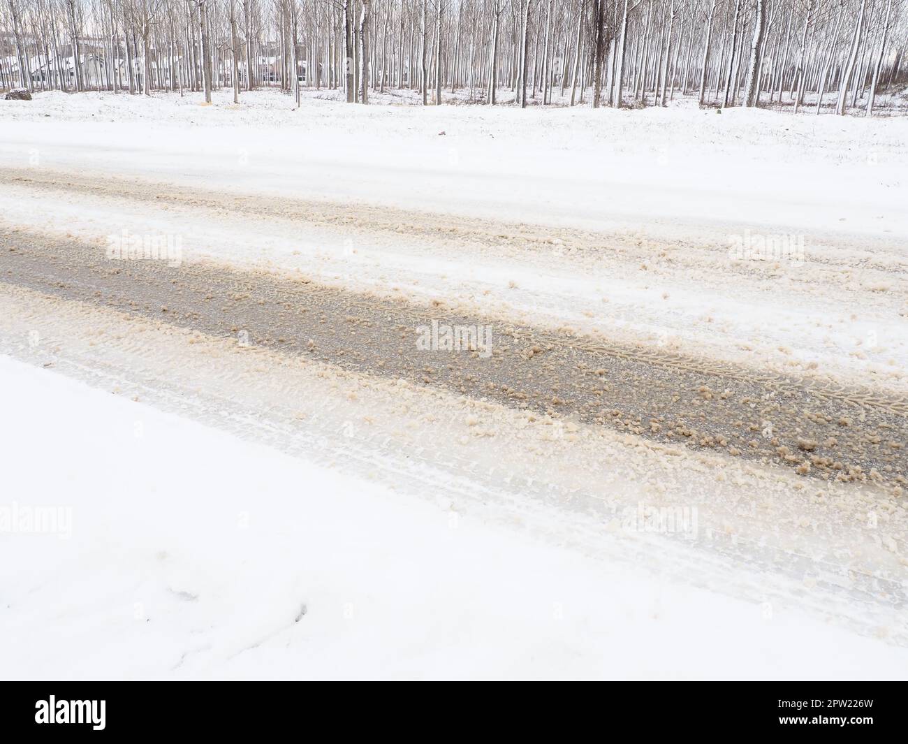 Snowdrifts on the side of the road. Bad weather and traffic. Snow on ...