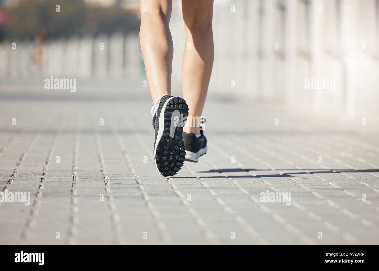 Runner, feet and woman on path to run for fitness, training and outdoor ...