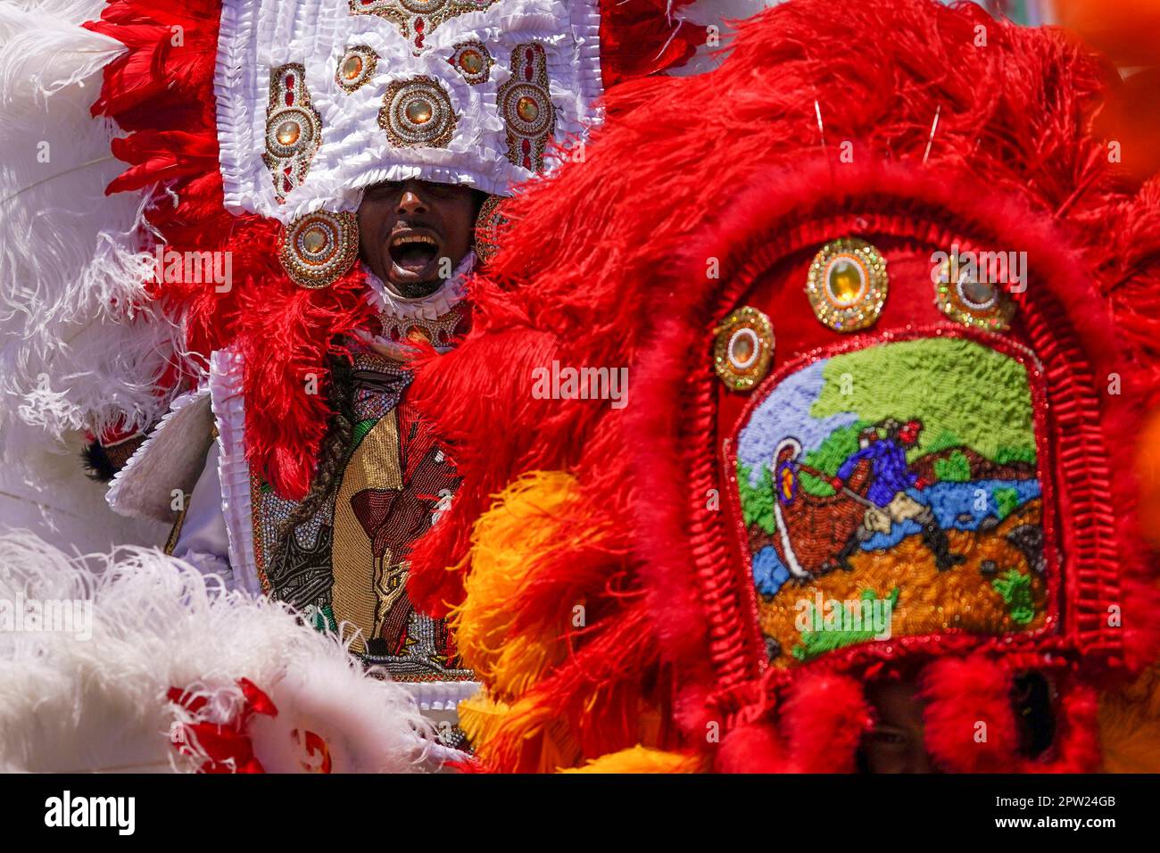 Members of the Golden Comanche Mardi Gras Indians parades through the New Orleans Jazz ...