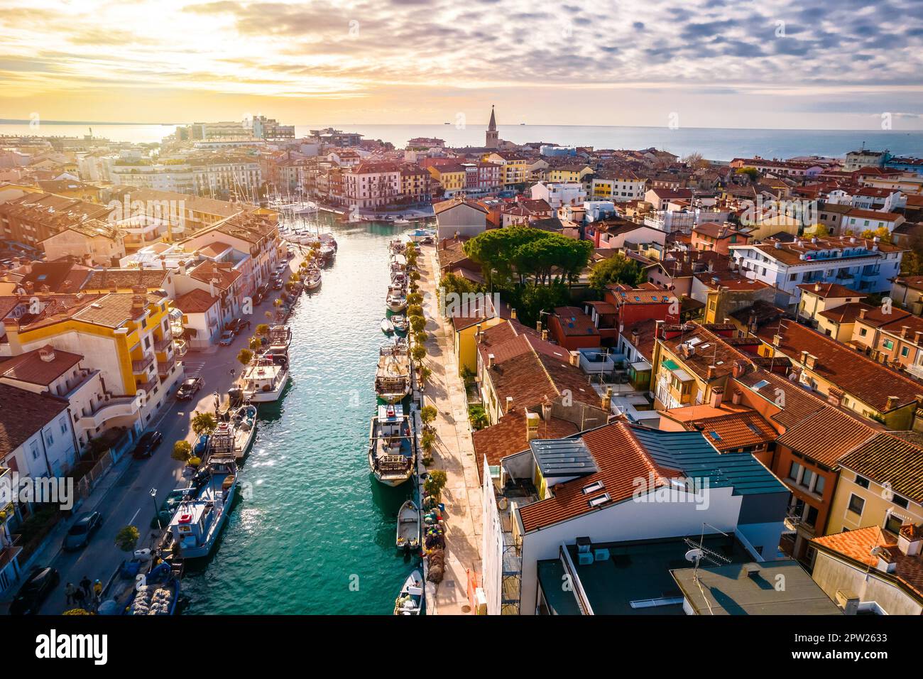 Town of Grado colorful architecture and channels aerial sunset view ...