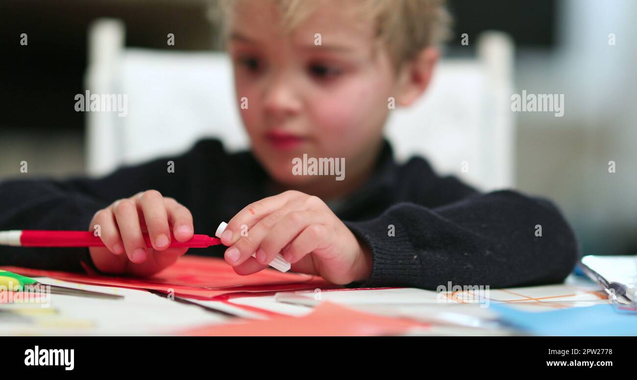 child boy drawing with pen Stock Photo - Alamy