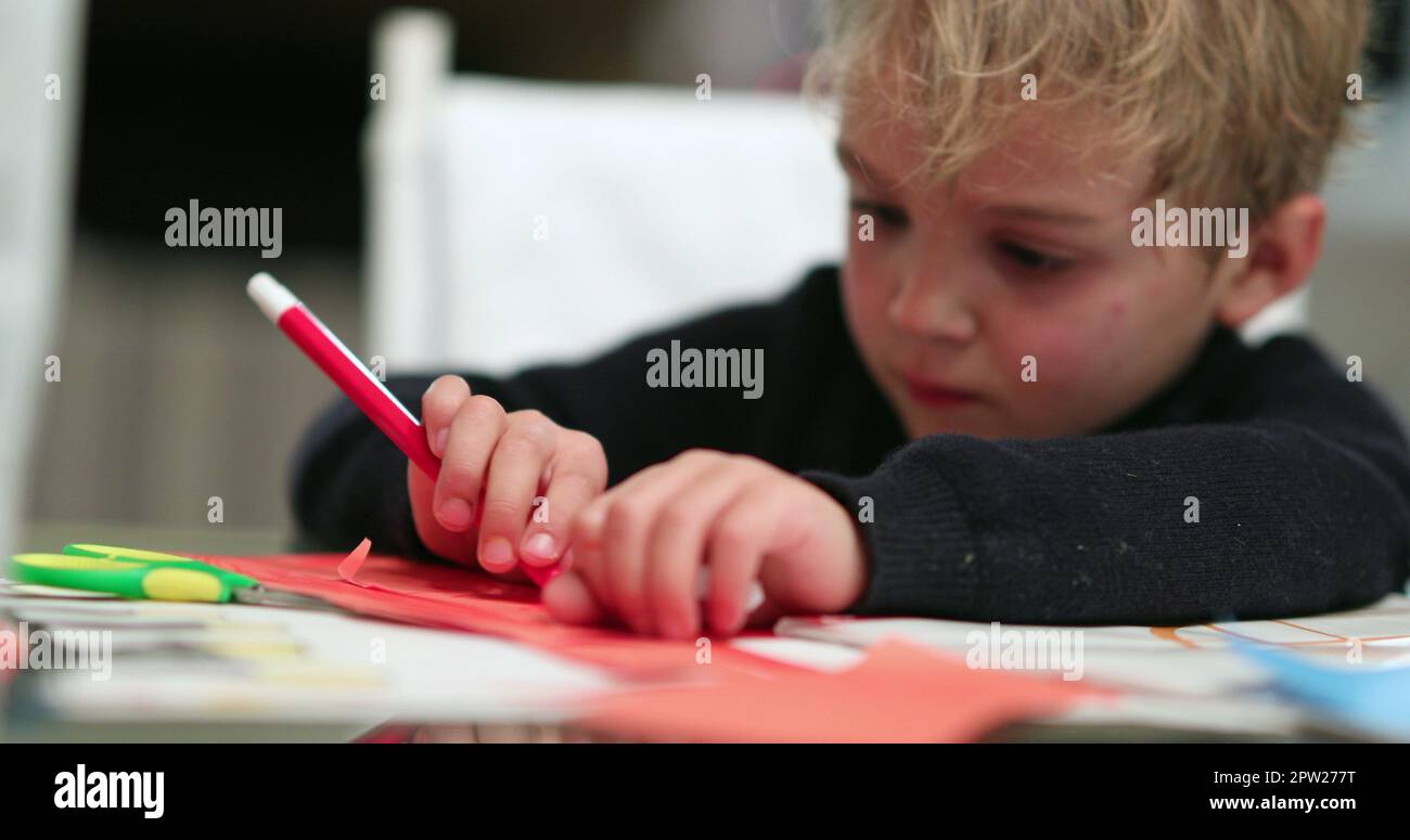 child boy drawing with pen Stock Photo - Alamy