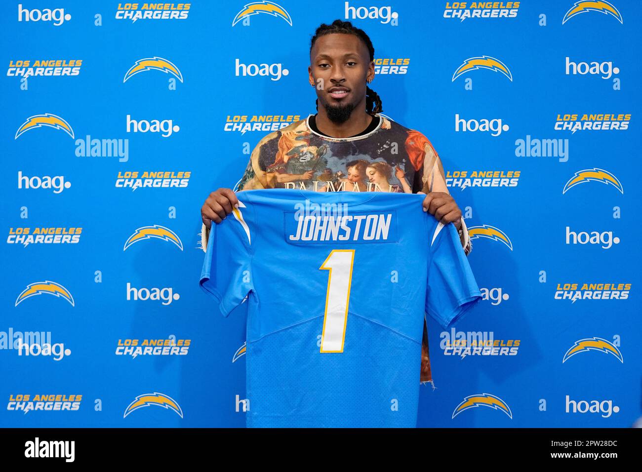 Quentin Johnston poses with his jersey after speaking at a news ...