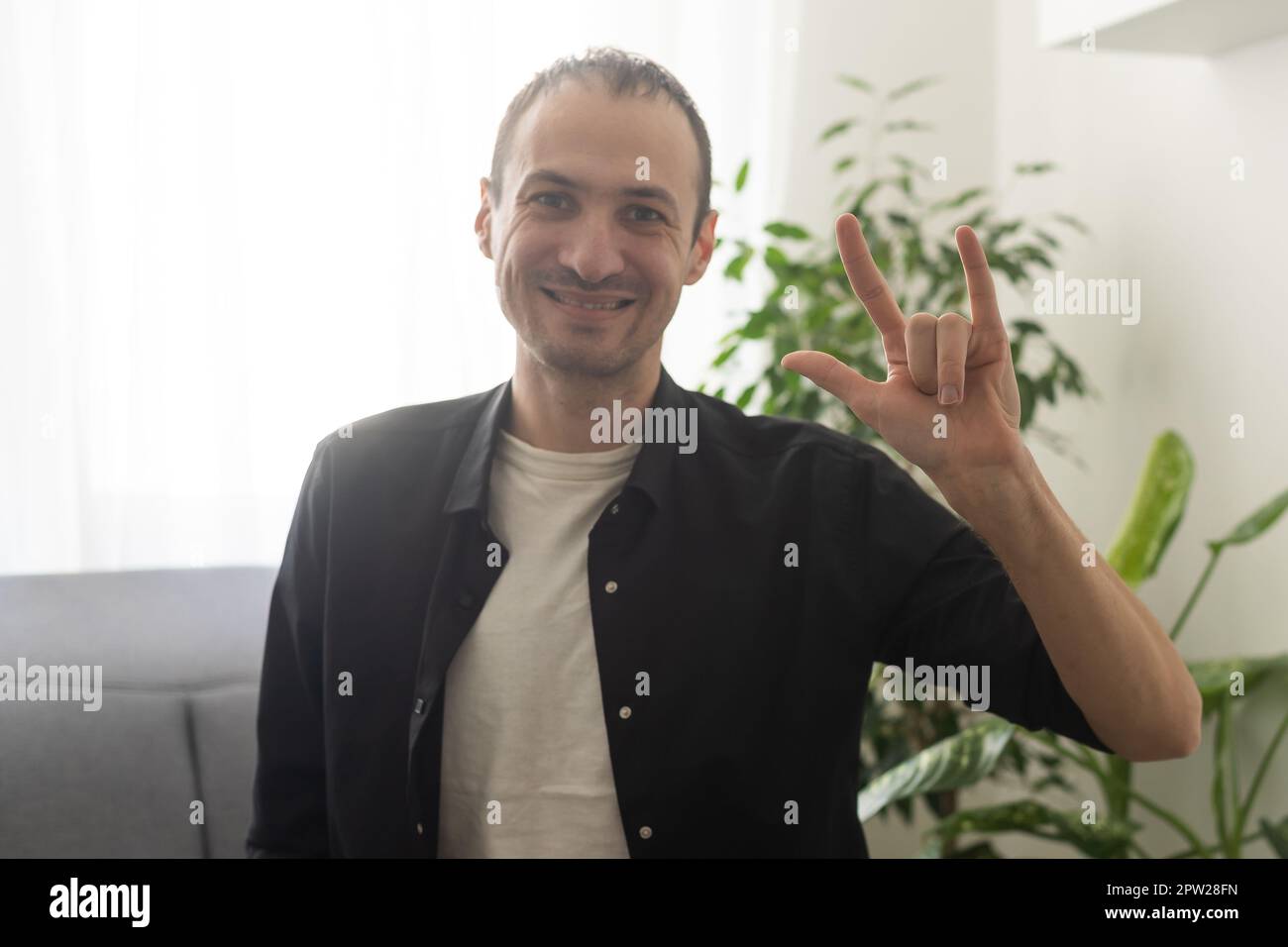 Adult Learning Sign Language For Deaf Disabled Stock Photo - Alamy