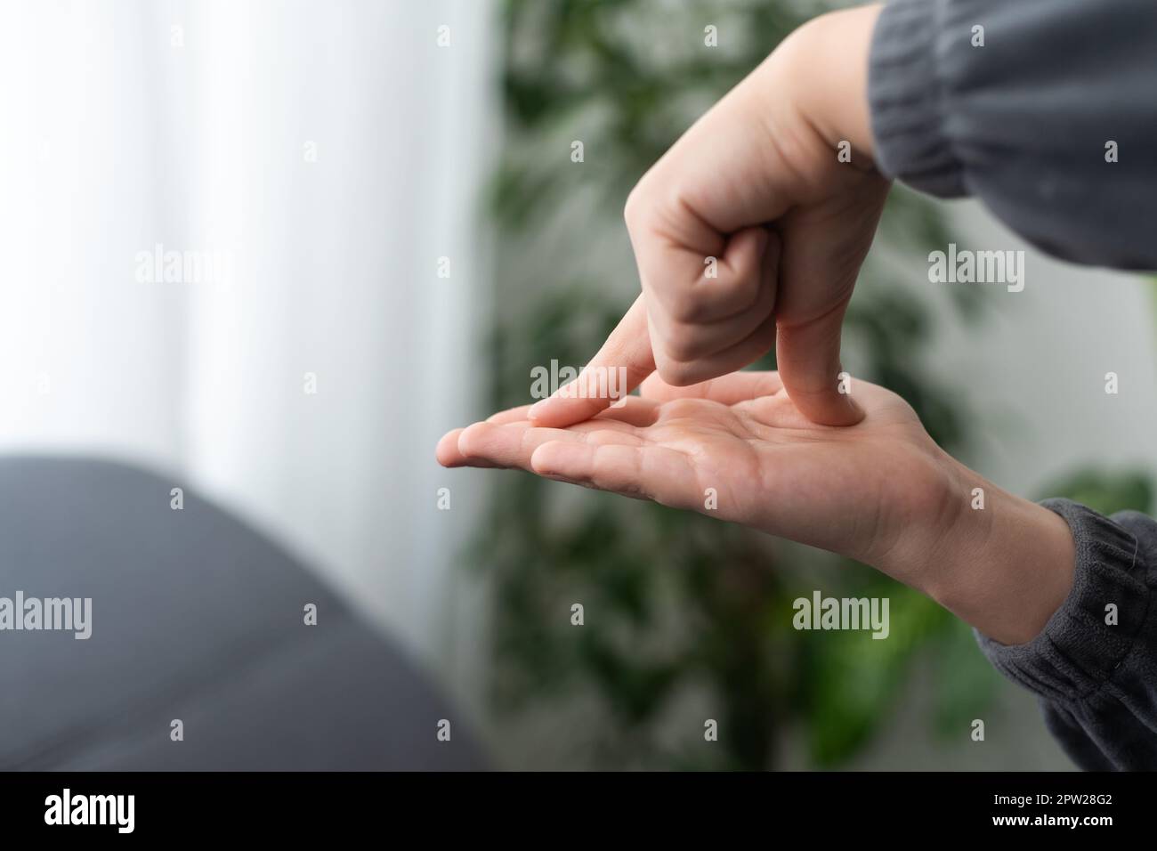 Beautiful smiling deaf girl using sign language Stock Photo - Alamy