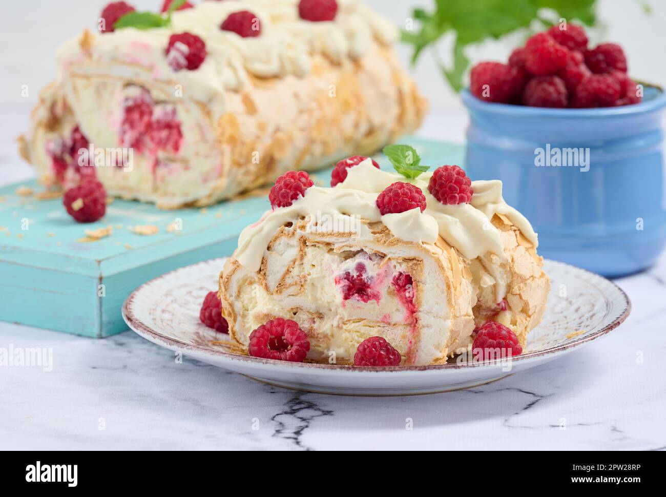 Baked meringue roll with cream and fresh red raspberry, white ...