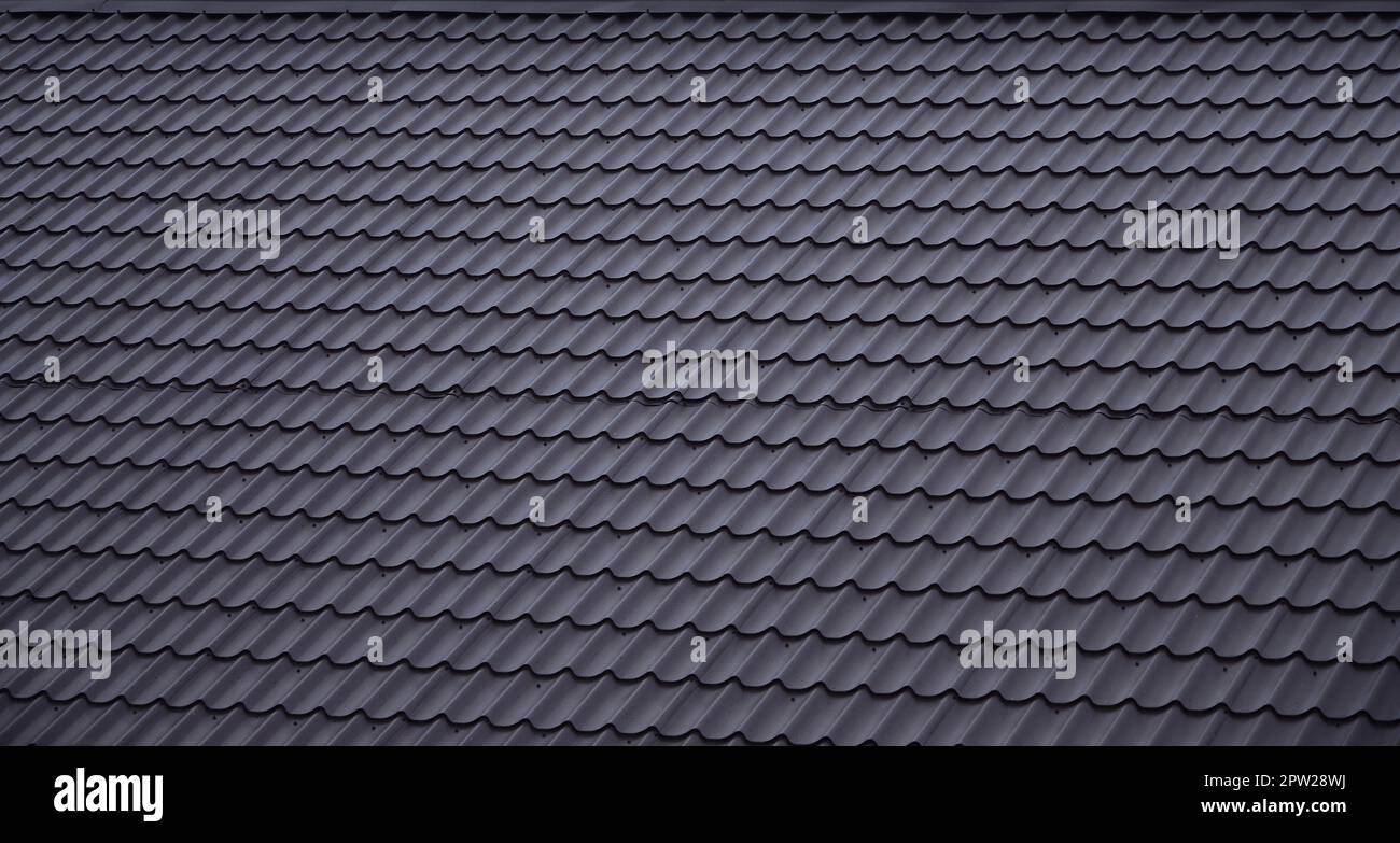 The texture of the roof of painted metal. Close-up detailed view of ...