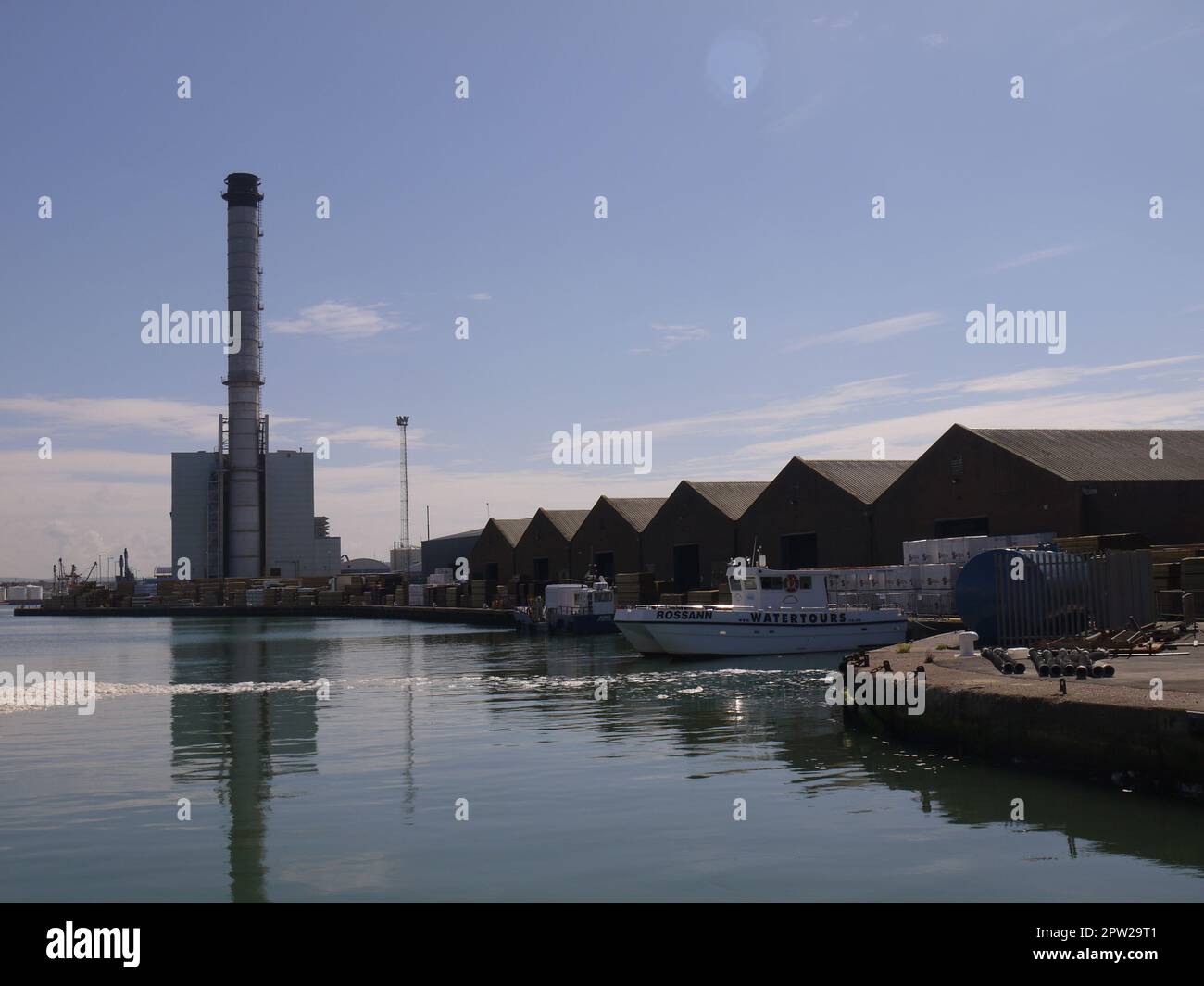 Stacks of imported timber piled up below Shoreham Power Station ...