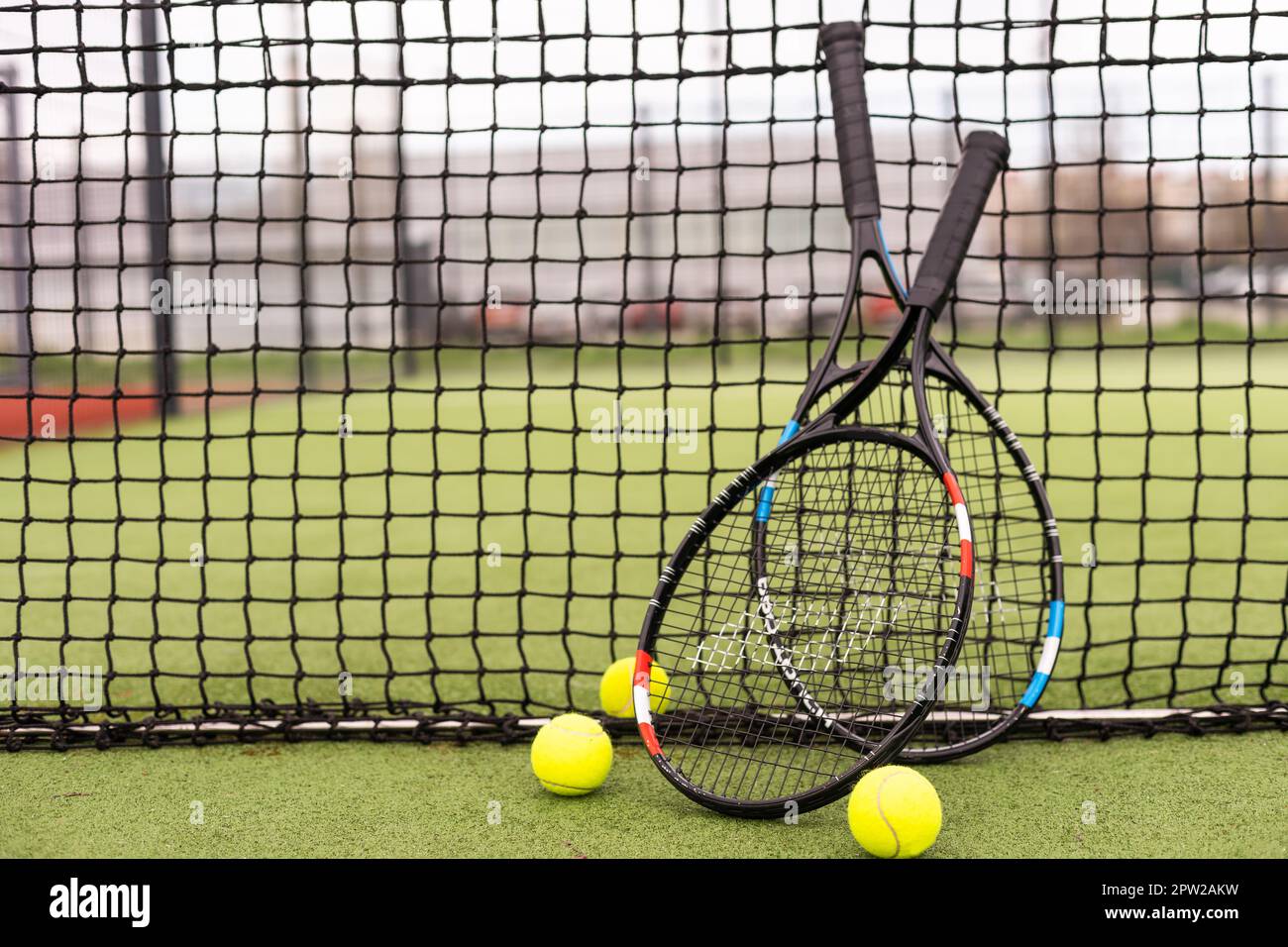 Tennis racket and tennis ball on court Stock Photo - Alamy