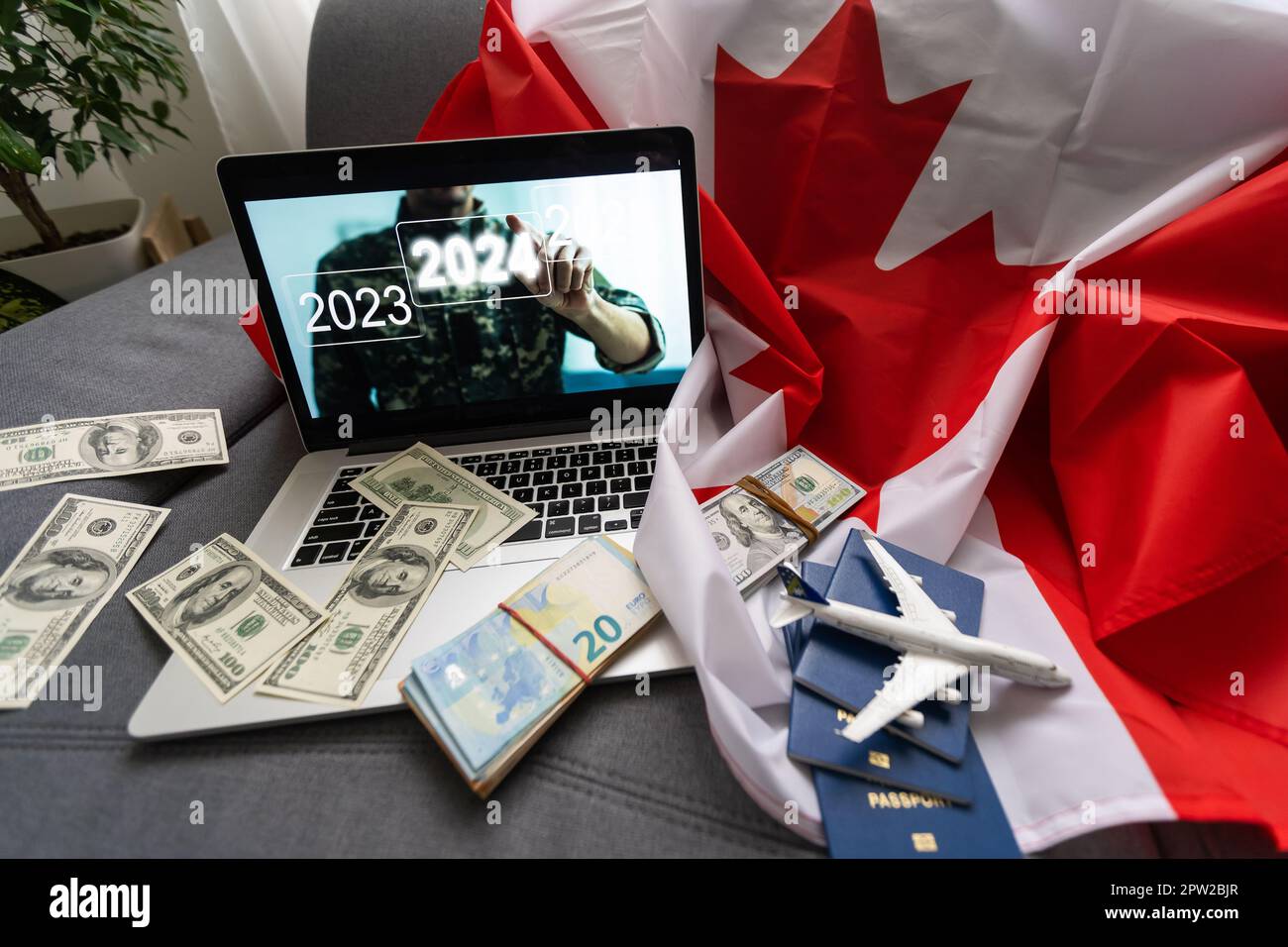 Plane flying by canadian flag hi-res stock photography and images - Alamy