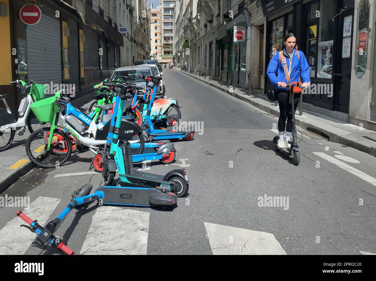 Paris, France. 28th Apr, 2023. Self-service scooters are scattered on ...