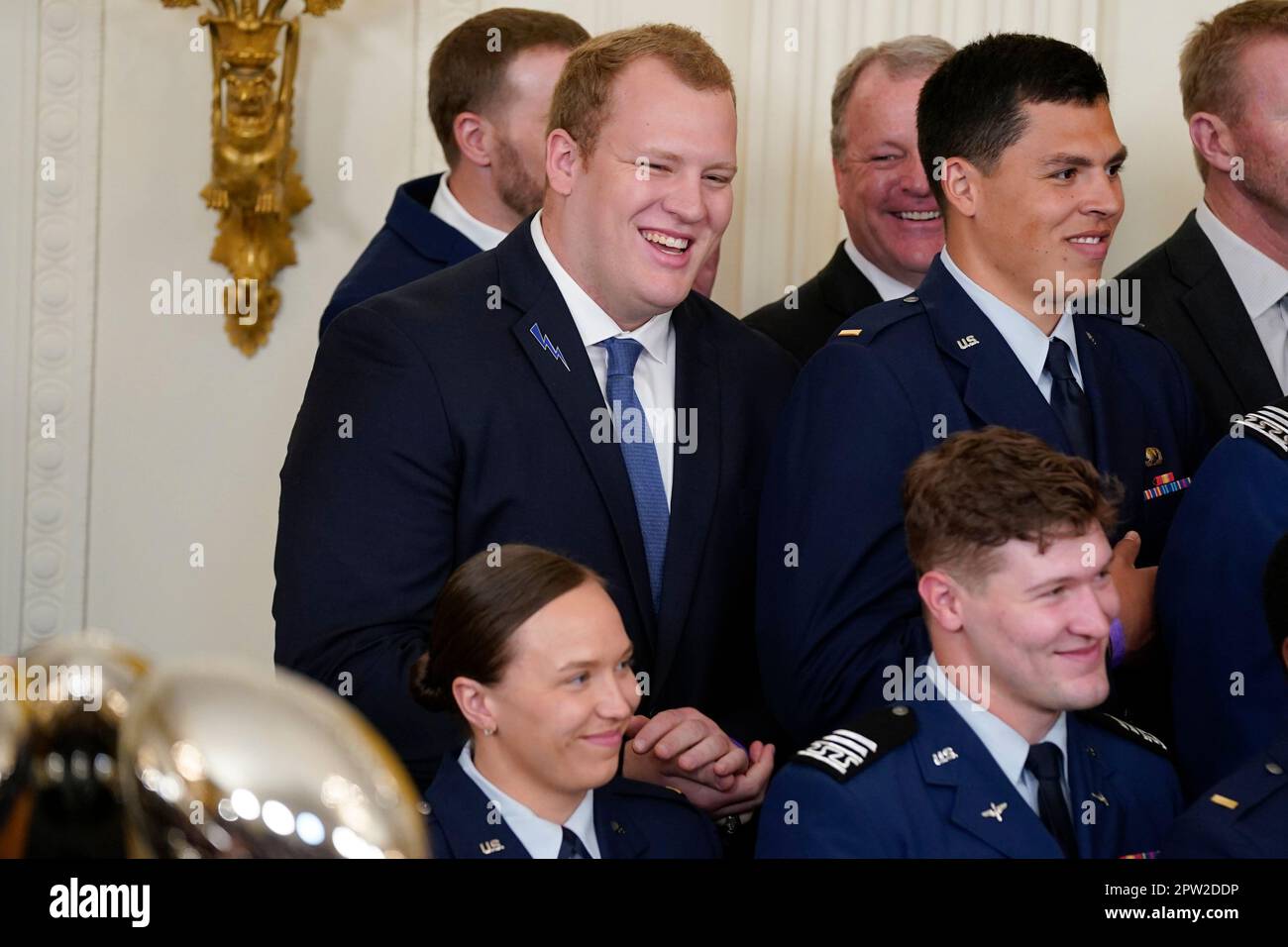 Air Force offensive lineman Isaac Cochran, second row at left, smiles ...