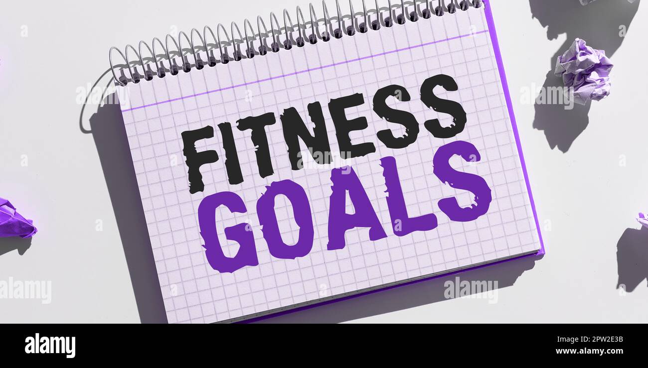 Hand writing sign Fitness Goals, Internet Concept Loose fat Build ...