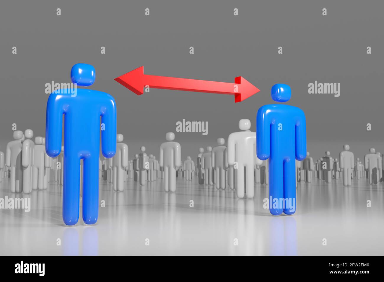 Two persons keeping safe distance amid a large crowd in a public space ...