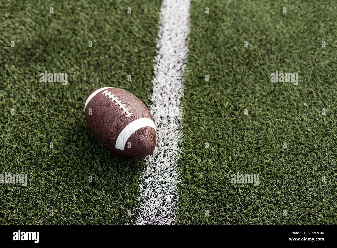American football rugby ball on the court Stock Photo - Alamy