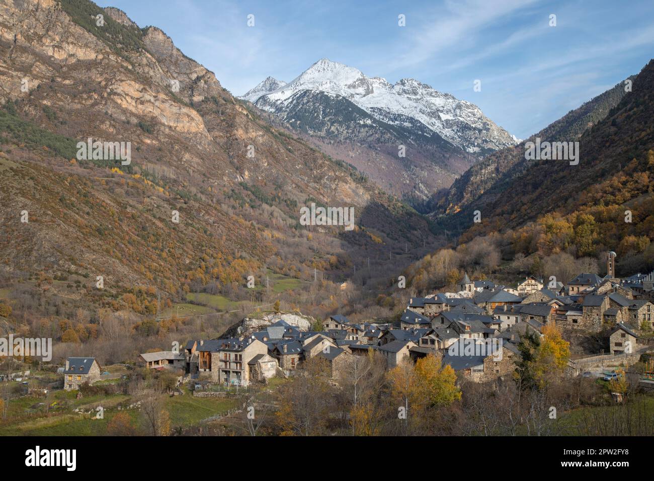 Snowy mountains under cloudy sky landscape in Boi Valley in Pyrenees in ...