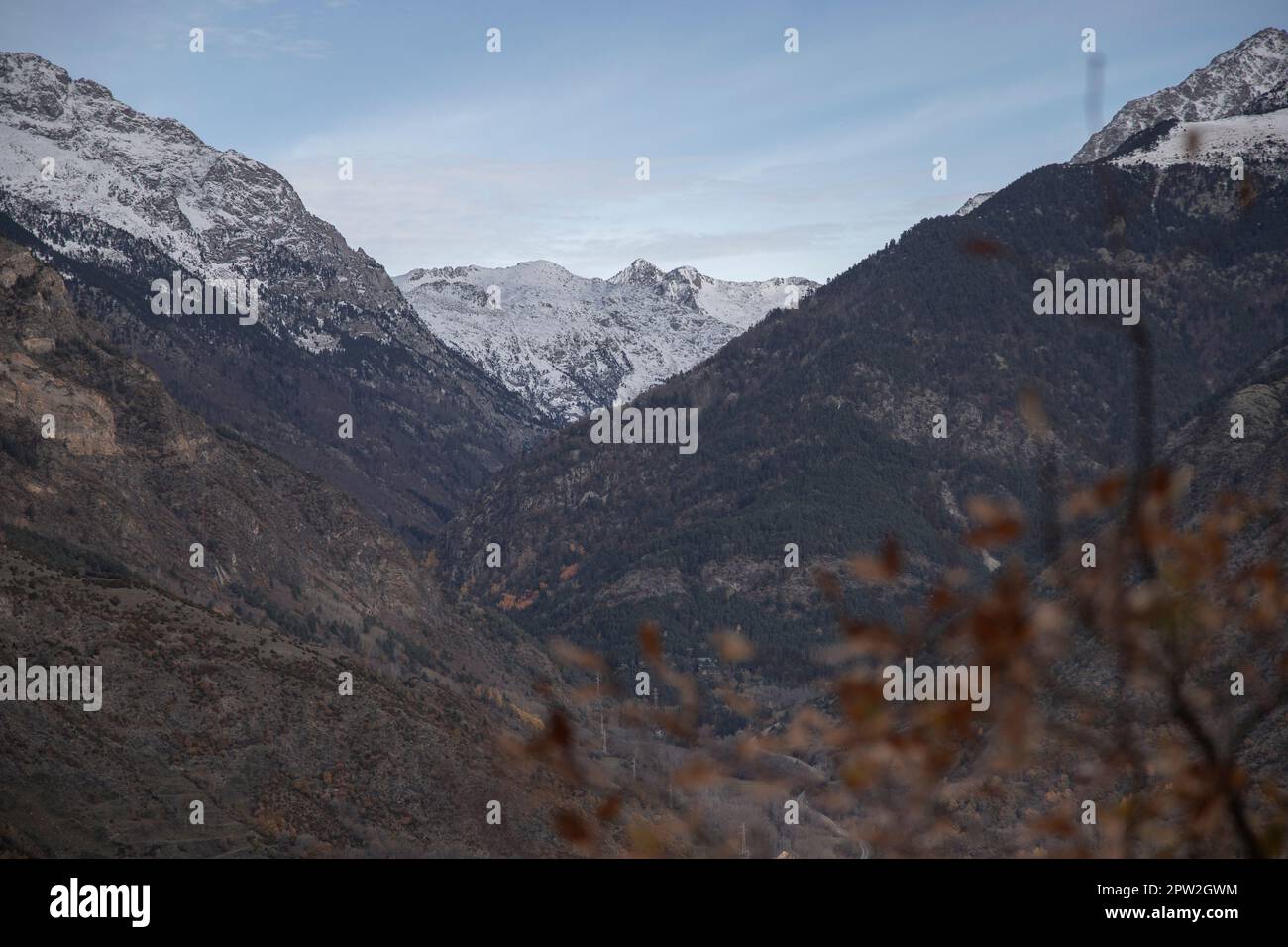 Snowy mountains under cloudy sky landscape in Boi Valley in Pyrenees in ...